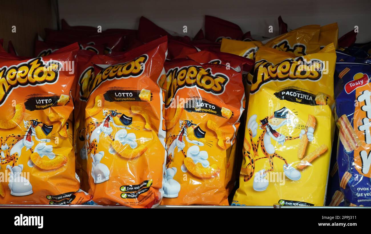 Limassol, Cyprus - 12.10.2022: A shelf with many packs of Cheetos ...