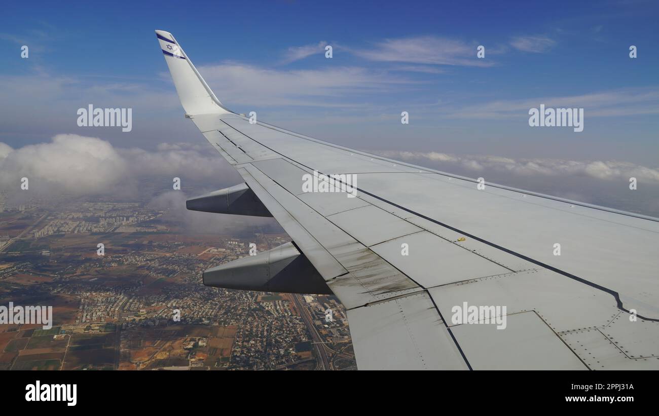 Wing of an airplane flying over Israel, Passenger s view. Looking ...