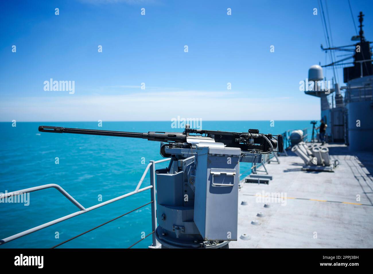 Automated machine gun on the deck of a military ship Stock Photo - Alamy
