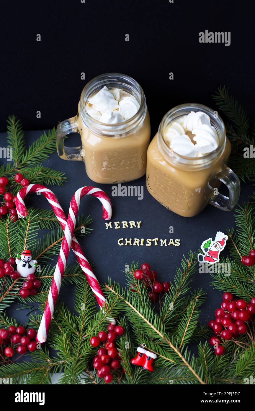 hot cocoa and candy marshmellou on the background of trees. The ...