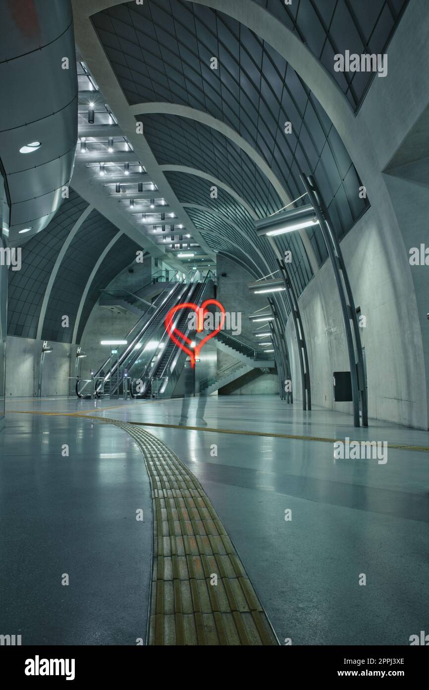 Red heart light painting in subway station in Cologne, Germany Stock ...