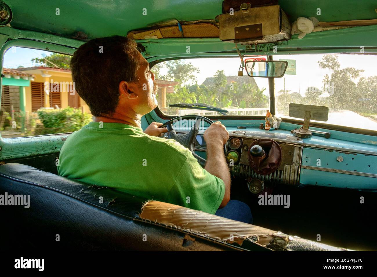 Taxi driver and interior Stock Photo - Alamy