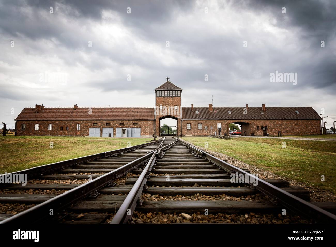 Railroad track to main gate of Auschwitz Stock Photo - Alamy