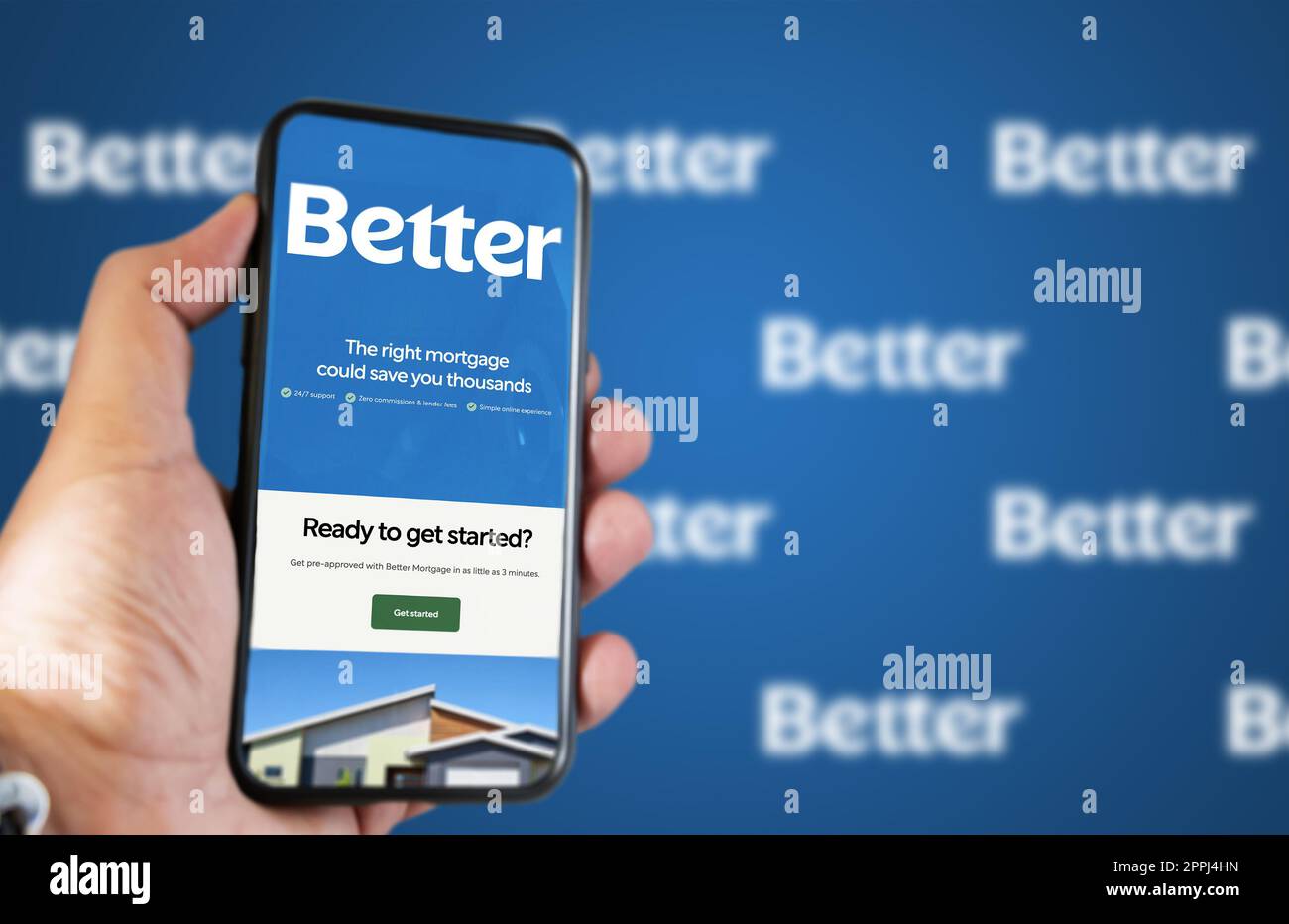 hand holding a phone with Better company web page on screen Stock Photo ...