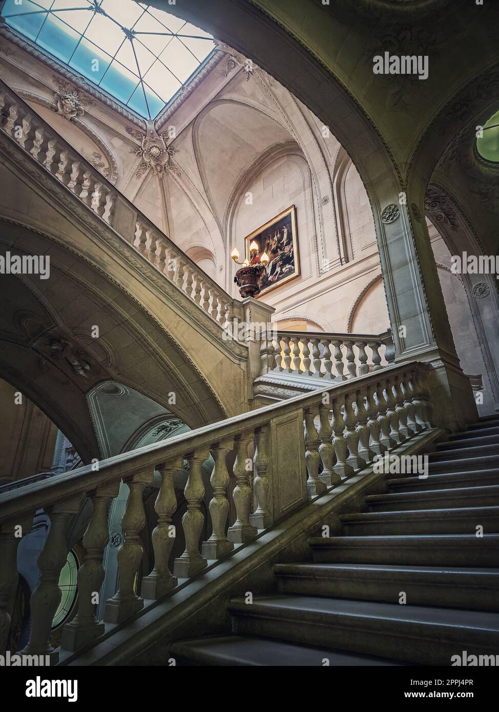 Louvre Palace architectural details of a hall with stone staircase ...