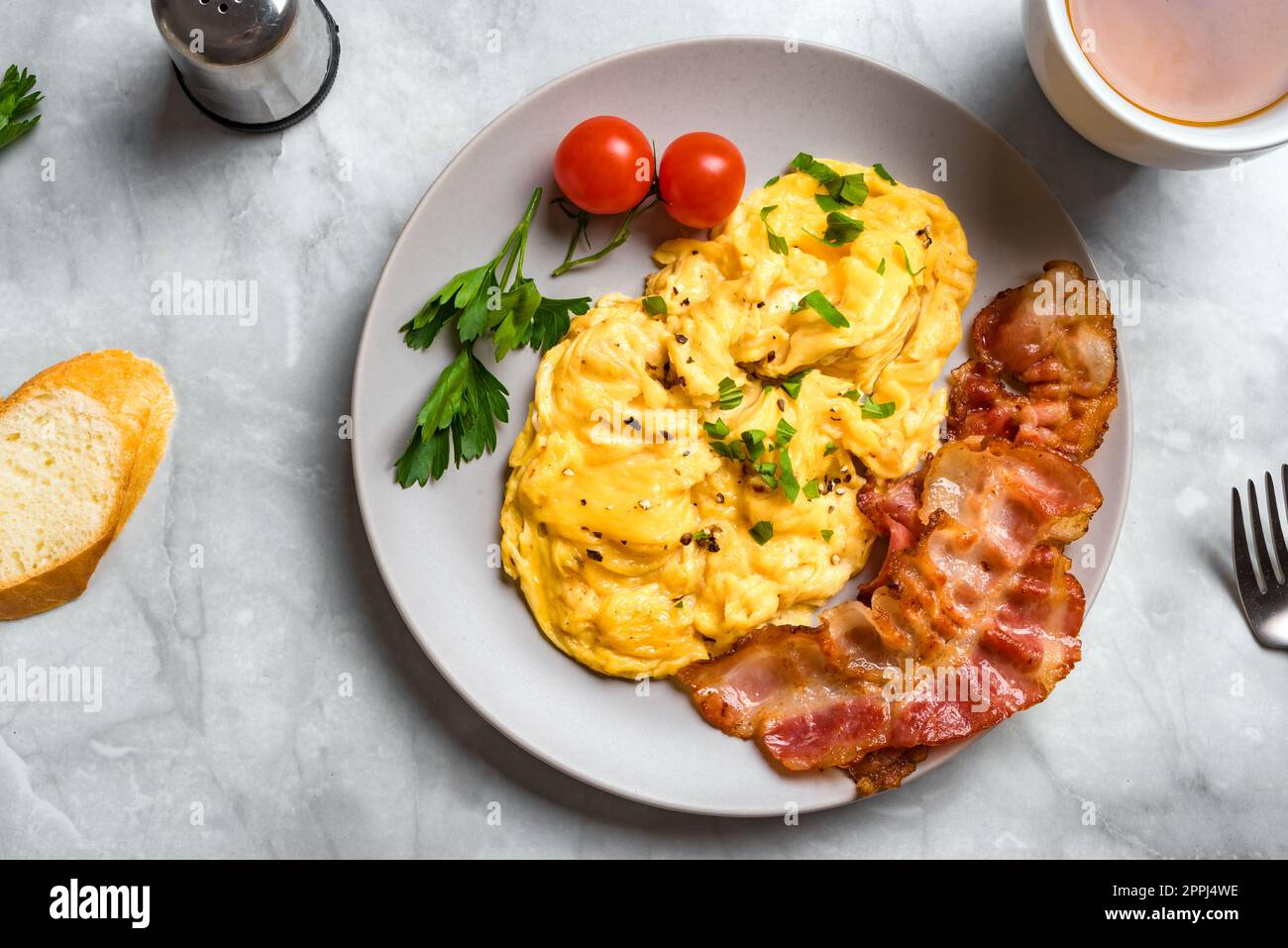 Scrambled Eggs and Bacon for breakfast, top view. Keto food, healthy ...