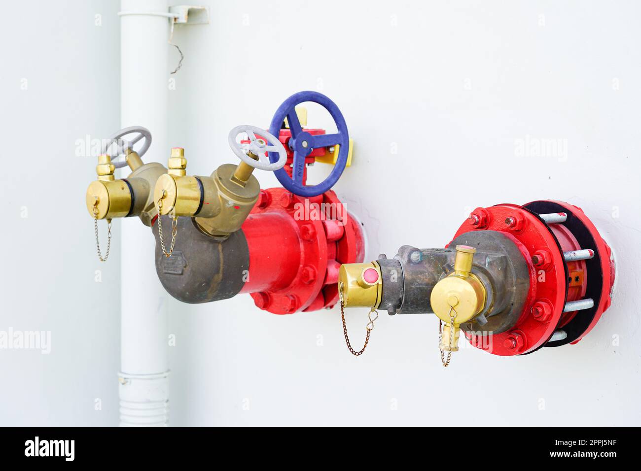 Red fire extinguishing system Stock Photo - Alamy