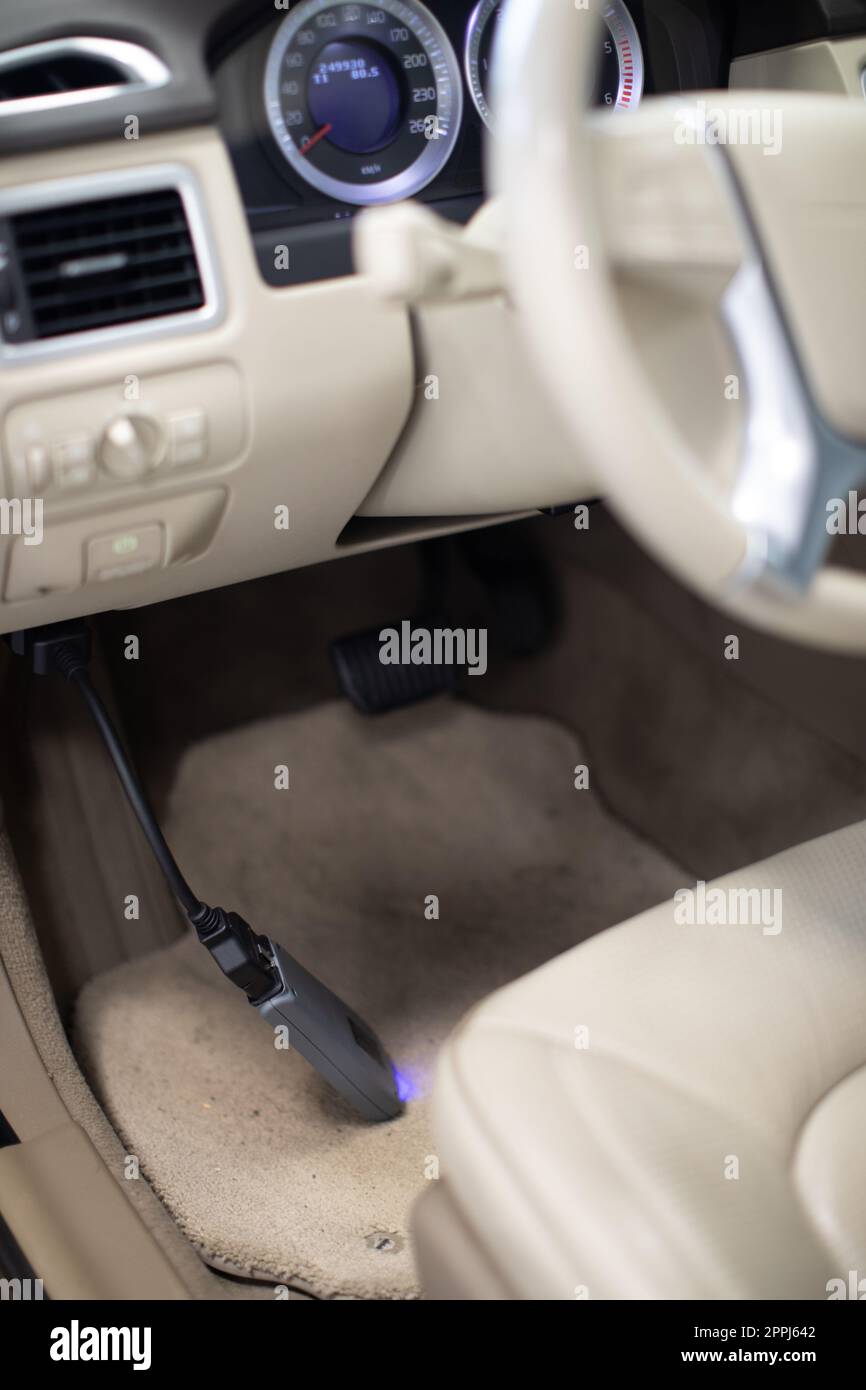 Car in a garage undergoing regular checks (shallow DOF/color toned ...