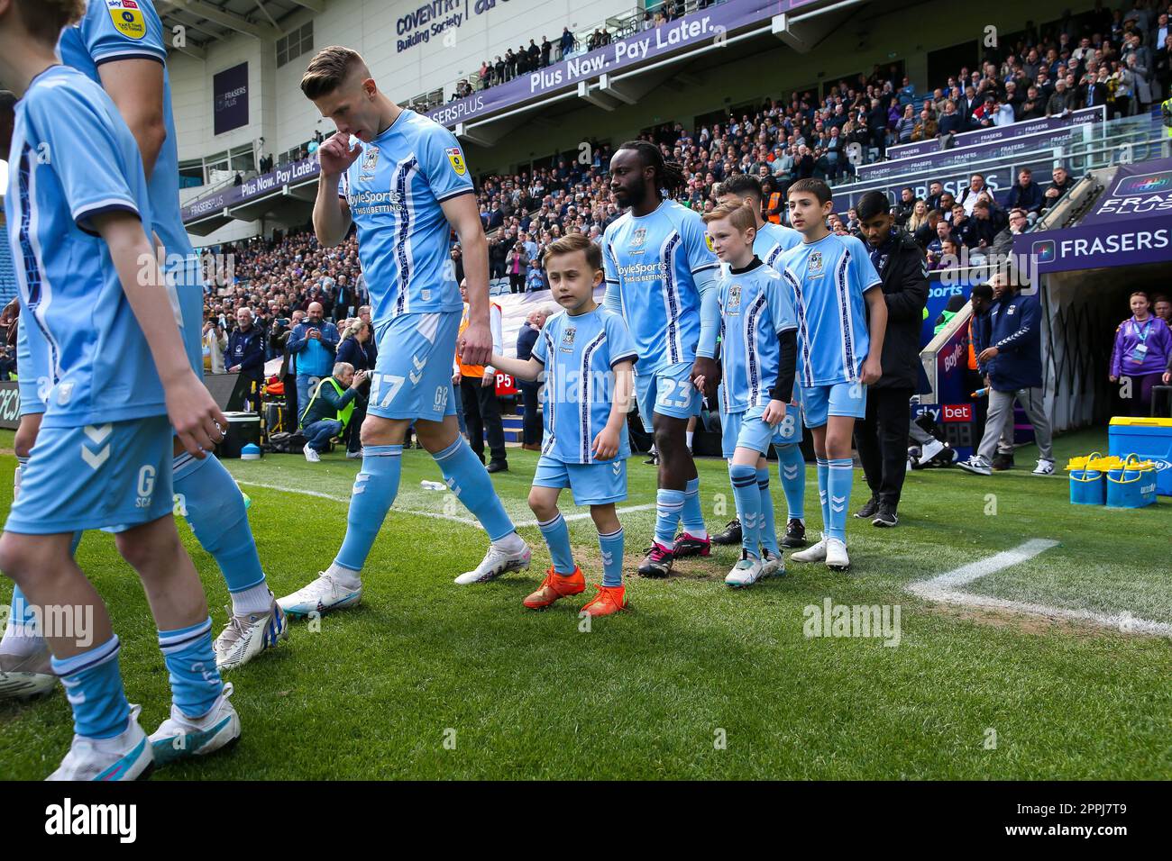 Coventry City’s players and match day mascots enter the pitch during ...
