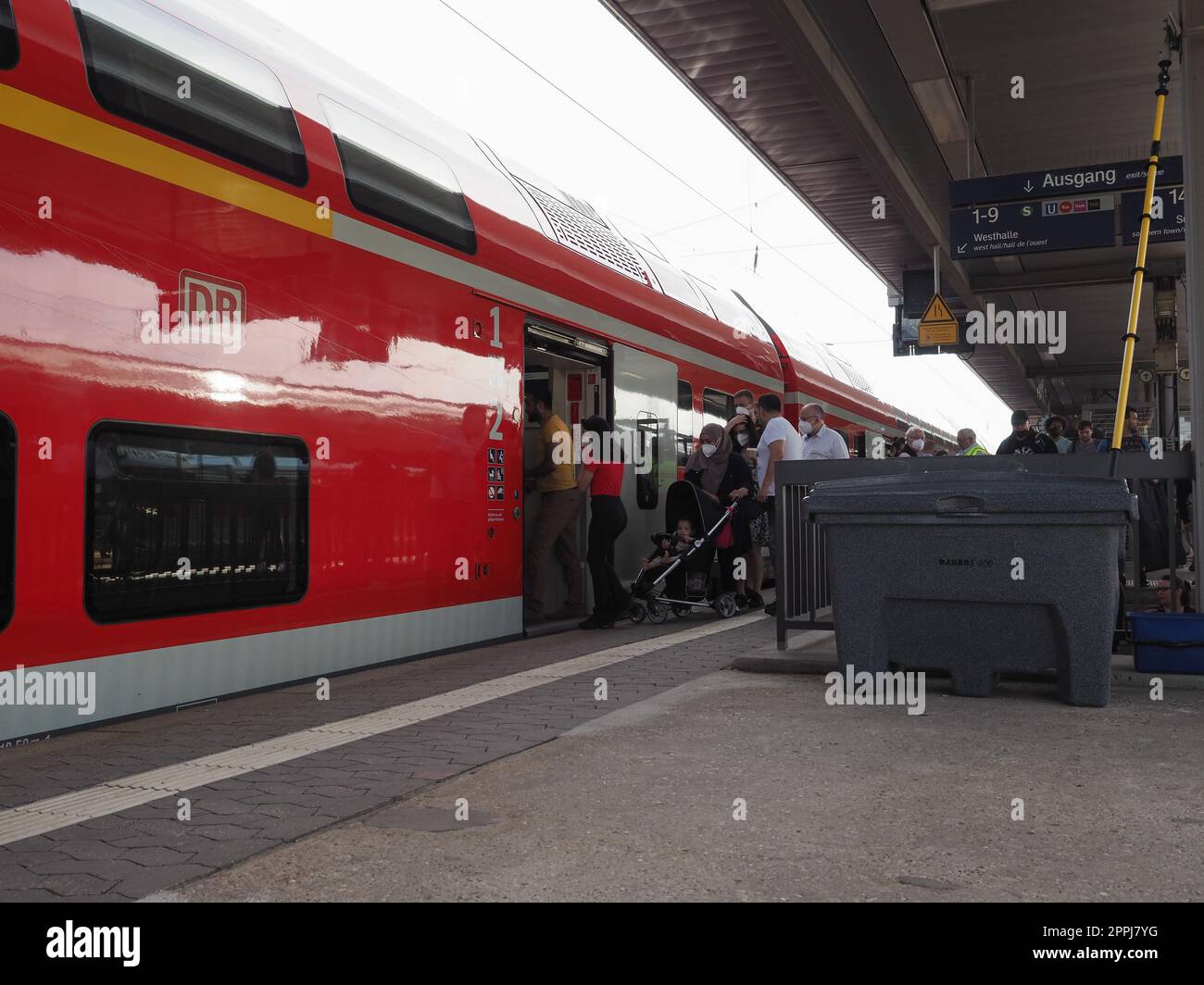 People boarding train at Nuernberg Hauptbahnhof central station in ...
