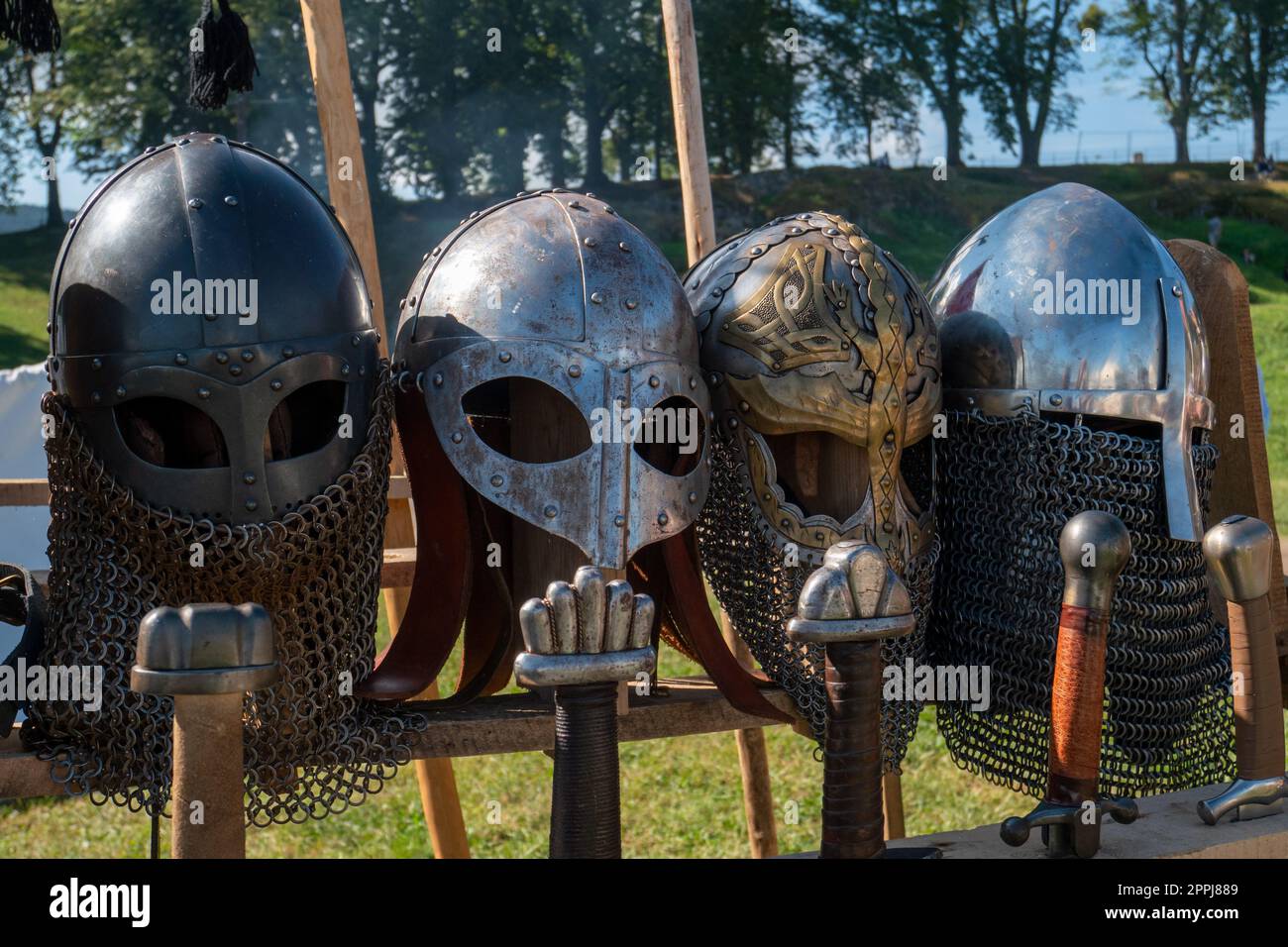 Vintage medieval metal armour fighting helmets Stock Photo - Alamy