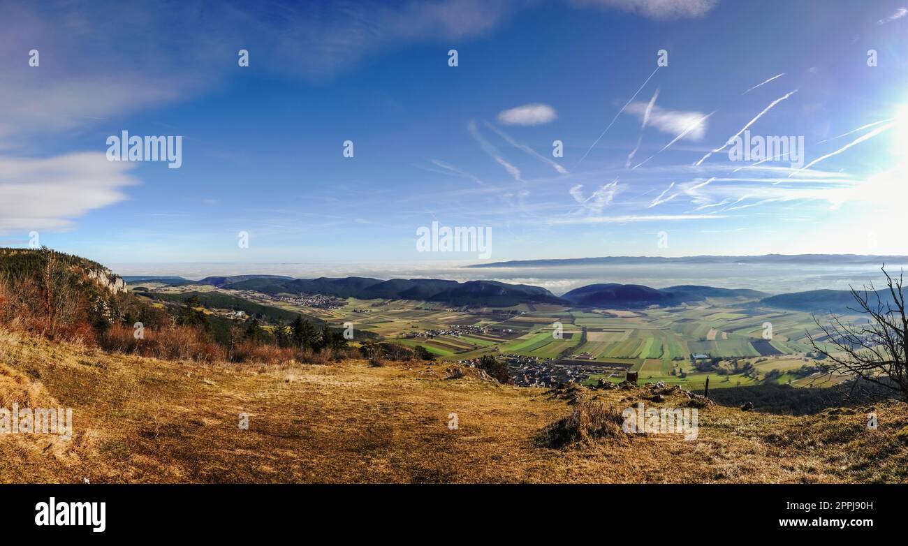 wonderful view to dense fog at the horizon with blue sky and sunshine ...
