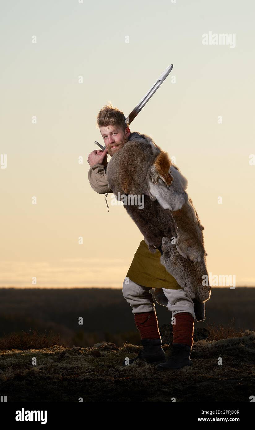 viking swinging sword like baseball player Stock Photo - Alamy