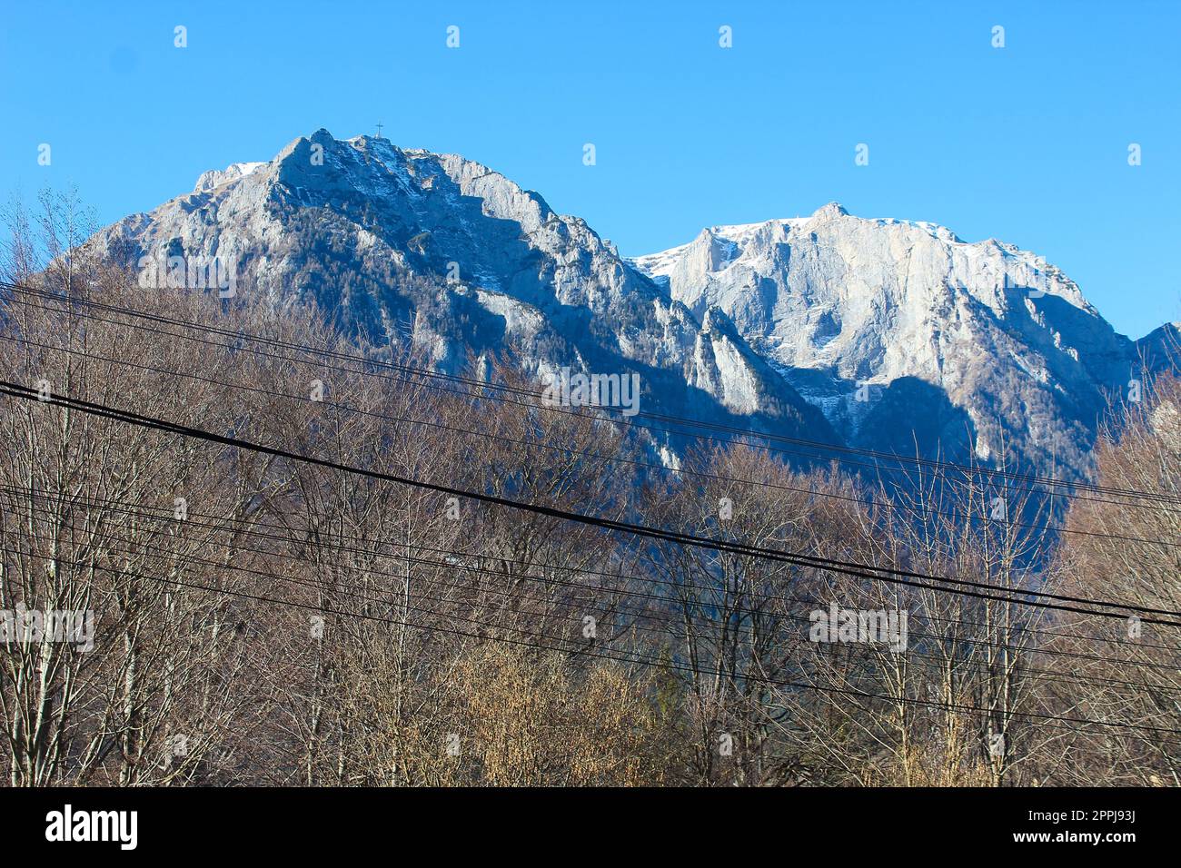 Sunny winter landscape with Bucegi mountains and Busteni ski resort in ...