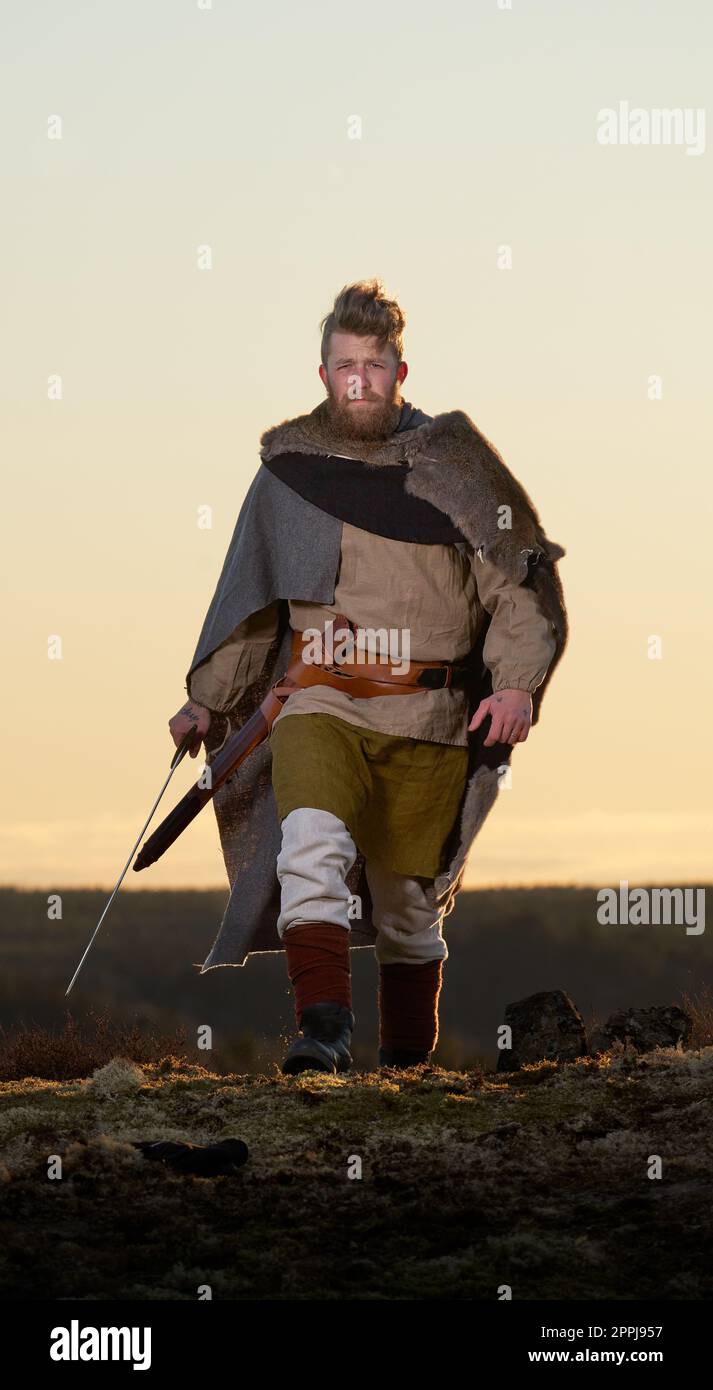 Viking attacking with sword Stock Photo - Alamy