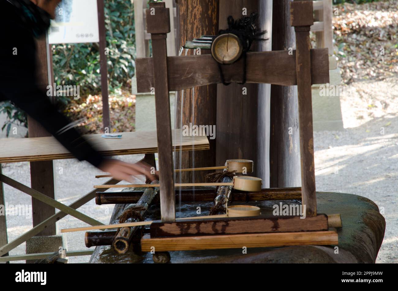Person in a traditional fountain for ablution Stock Photo - Alamy