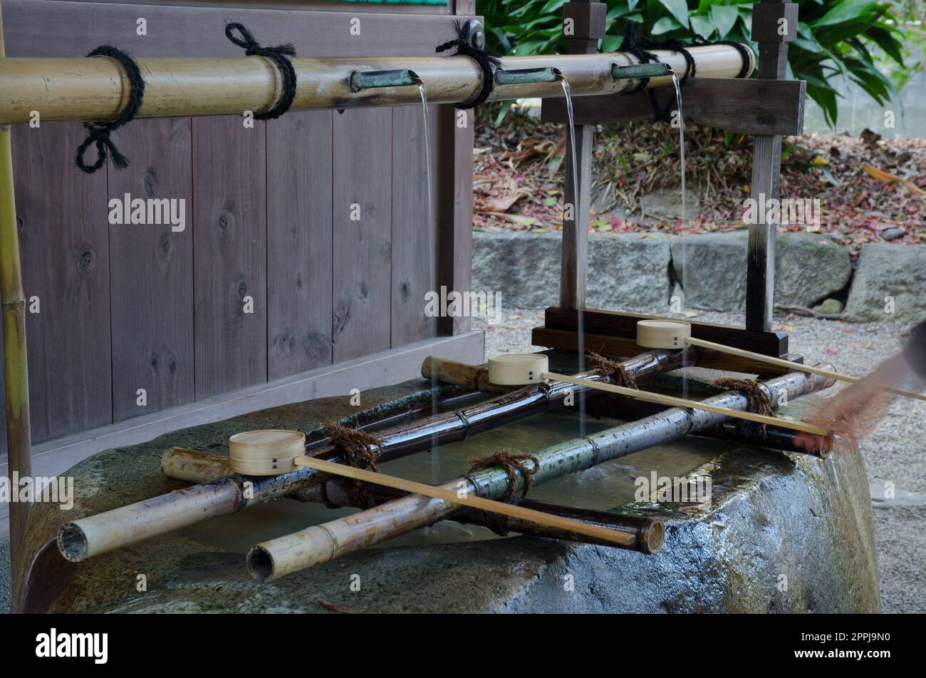 Person in a traditional fountain for ablution Stock Photo - Alamy