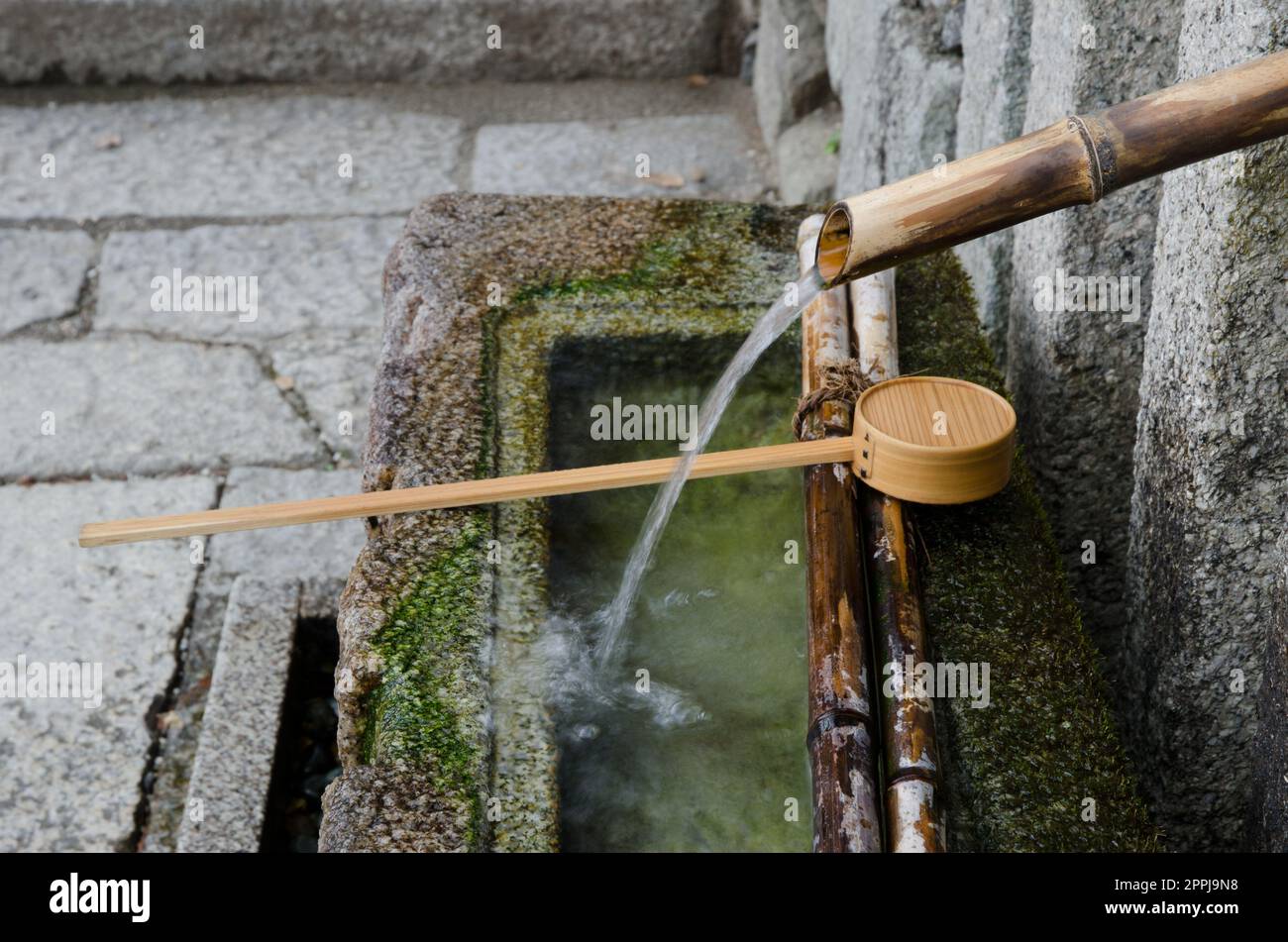 Traditional fountain for ablution in the Shimogamo Shrine Stock Photo ...