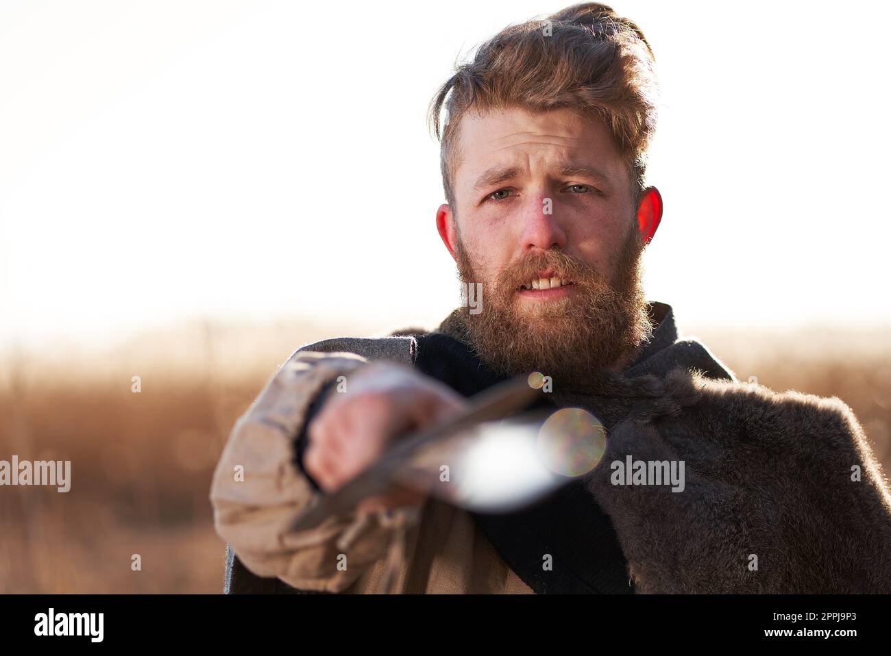 Viking pointing sword Stock Photo - Alamy