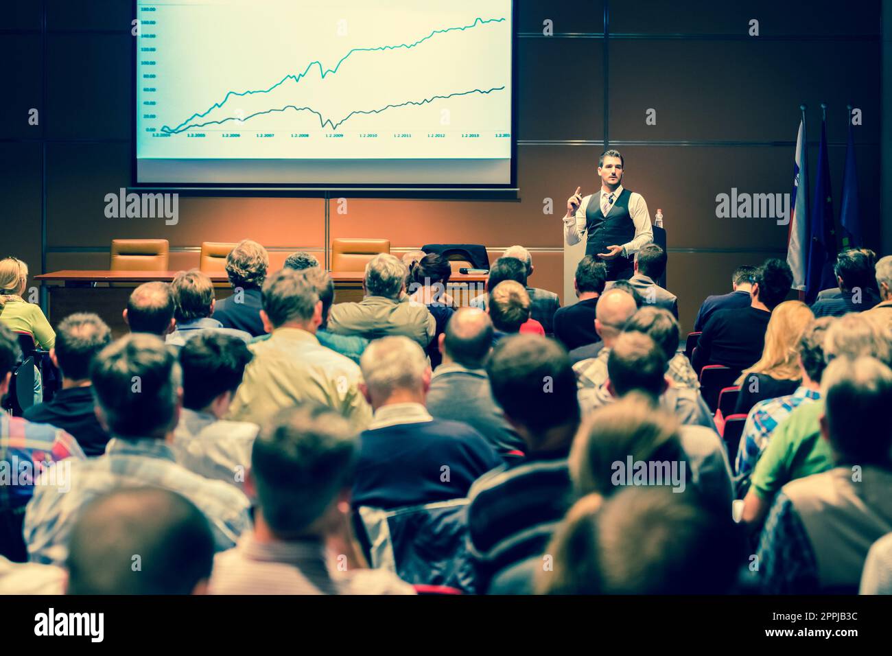 Business speaker giving a talk at business conference meeting event ...