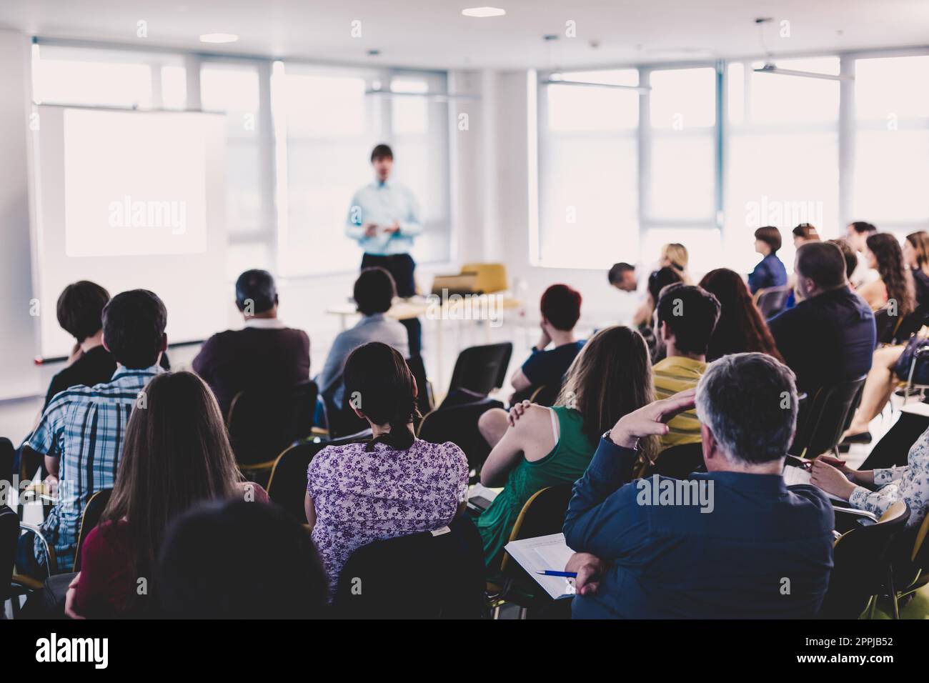 Speaker giving presentation on business conference event Stock Photo ...
