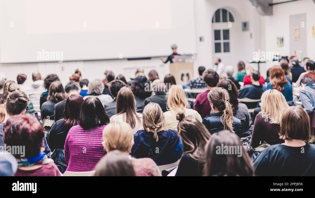 Woman giving presentation on business conference Stock Photo - Alamy