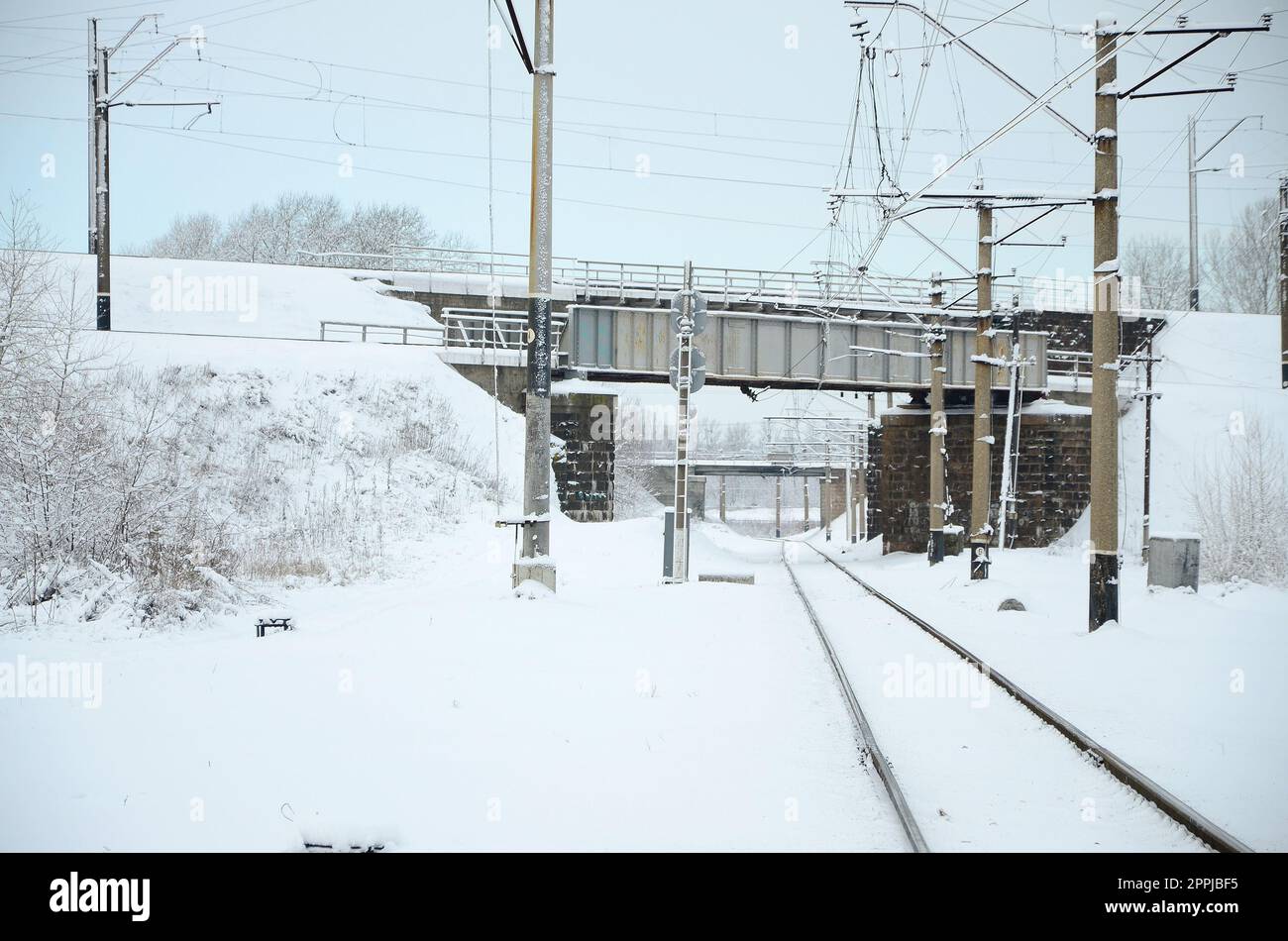 Winter railway landscape, Railway tracks in the snow-covered industrial ...