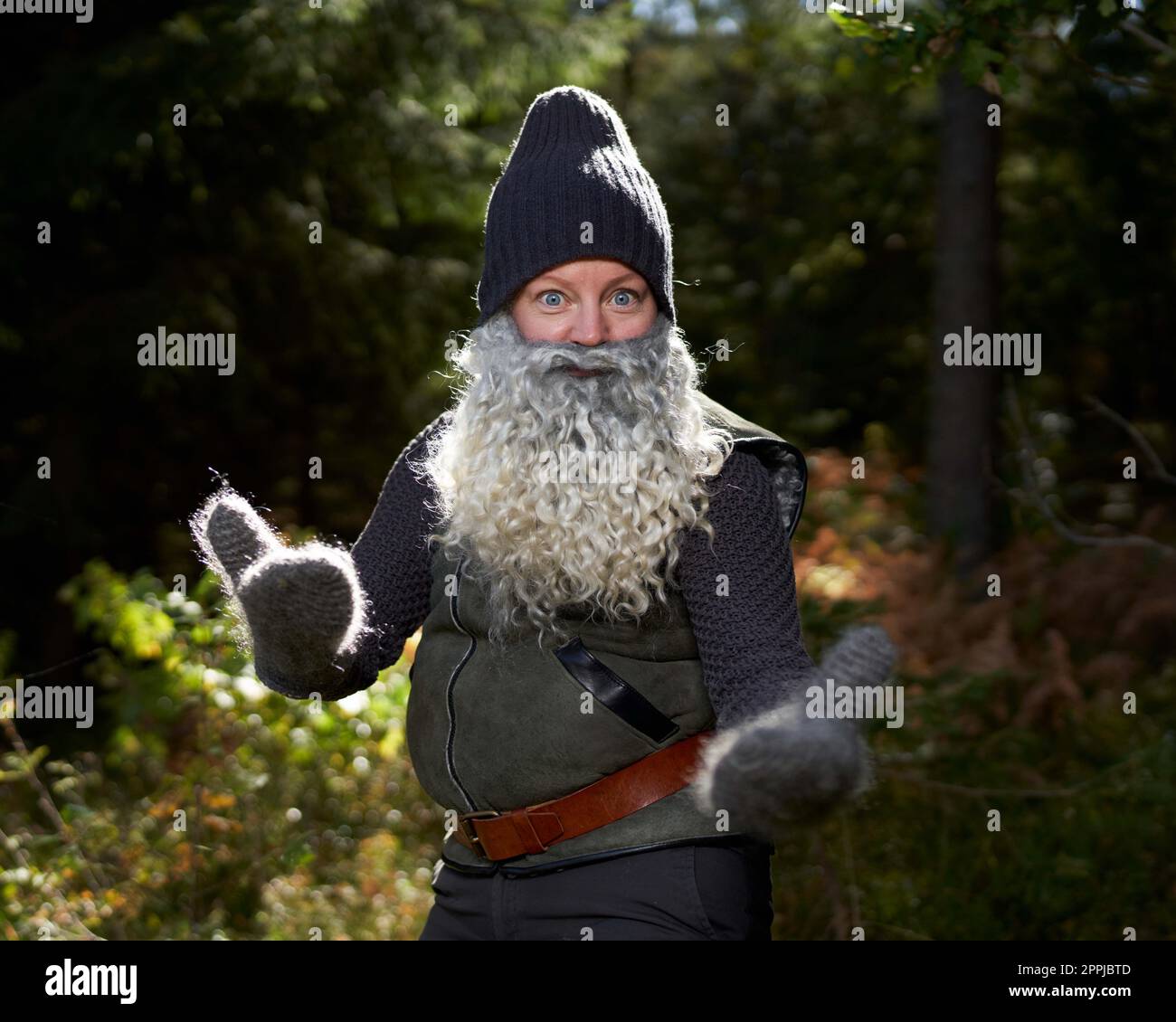 Scandinavian gnome in the forest wearing a grey outfit Stock Photo - Alamy