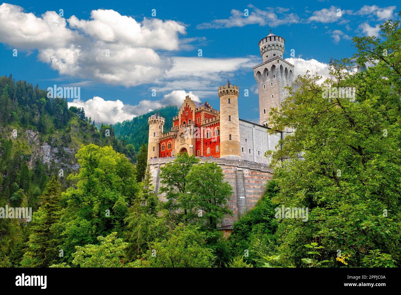 Front view of the faÃ§ade of Neuschwanstein Castle with entrance area ...