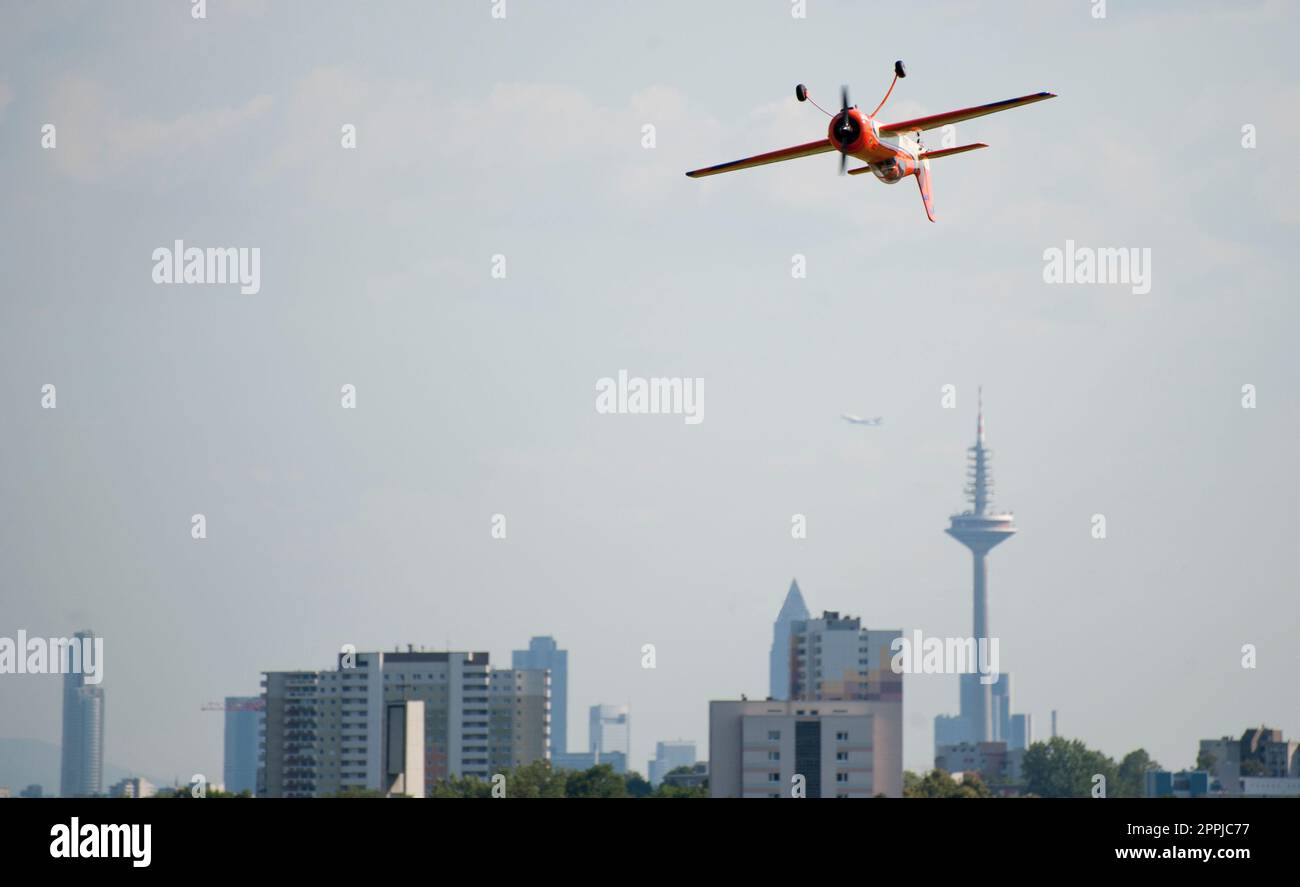 A propeller plane flying upside down during an aerobatic display ...