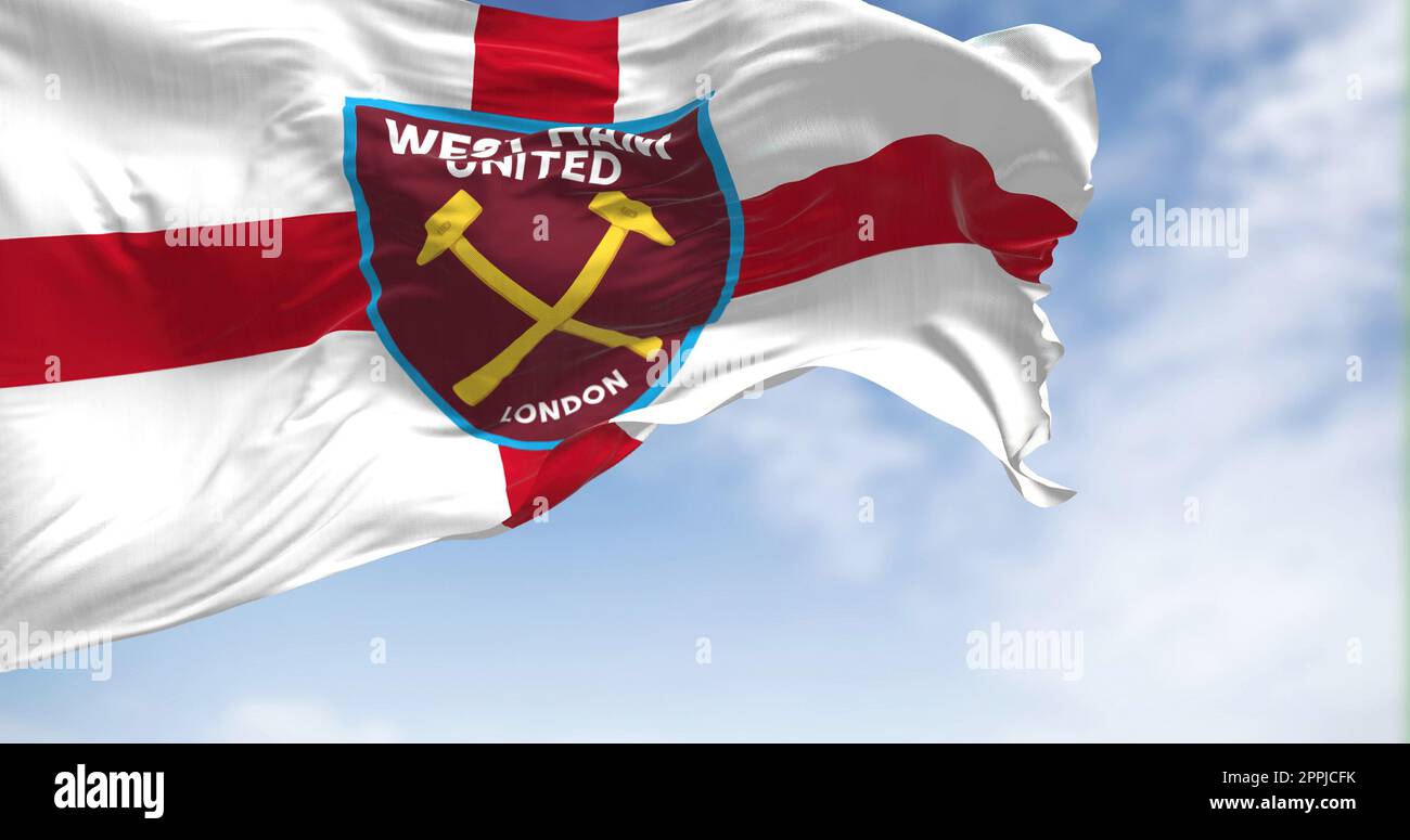 The flag of West Ham United F.C. waving in the wind on a clear day ...