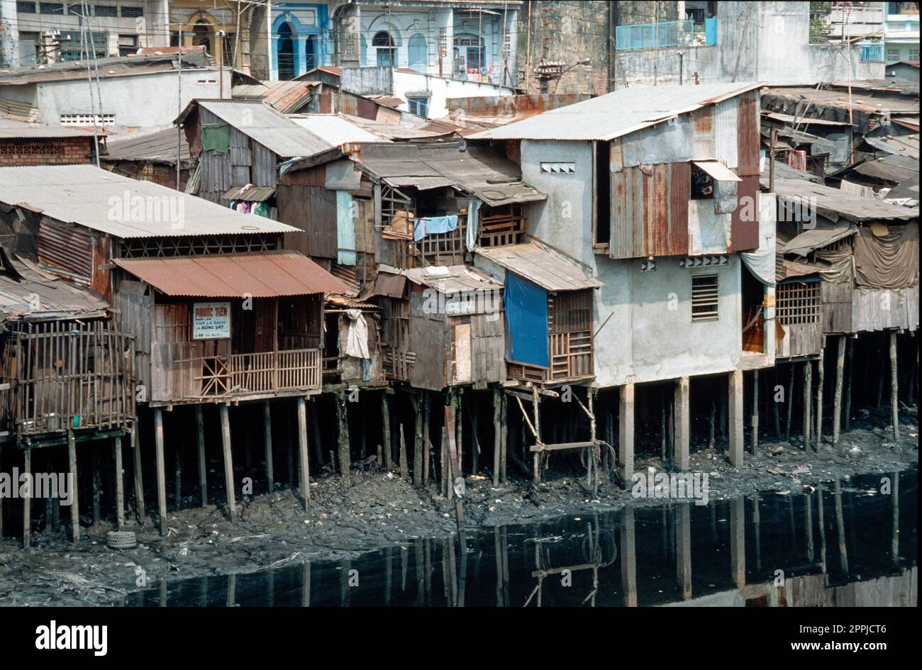 Scanned slide of historical color photograph of slum in the Old Quarter ...