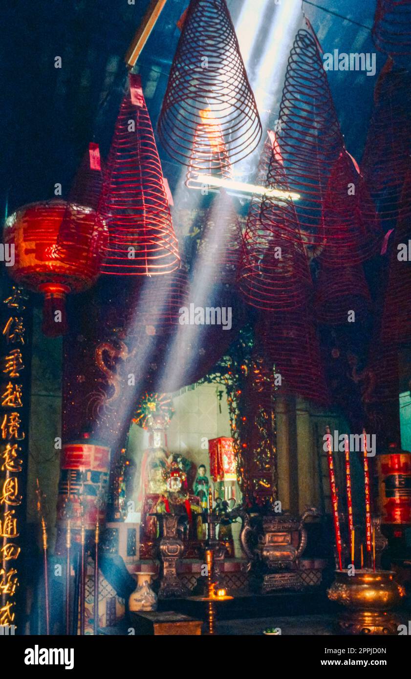 Scanned slide of historical color photograph showing smoke from incense ...
