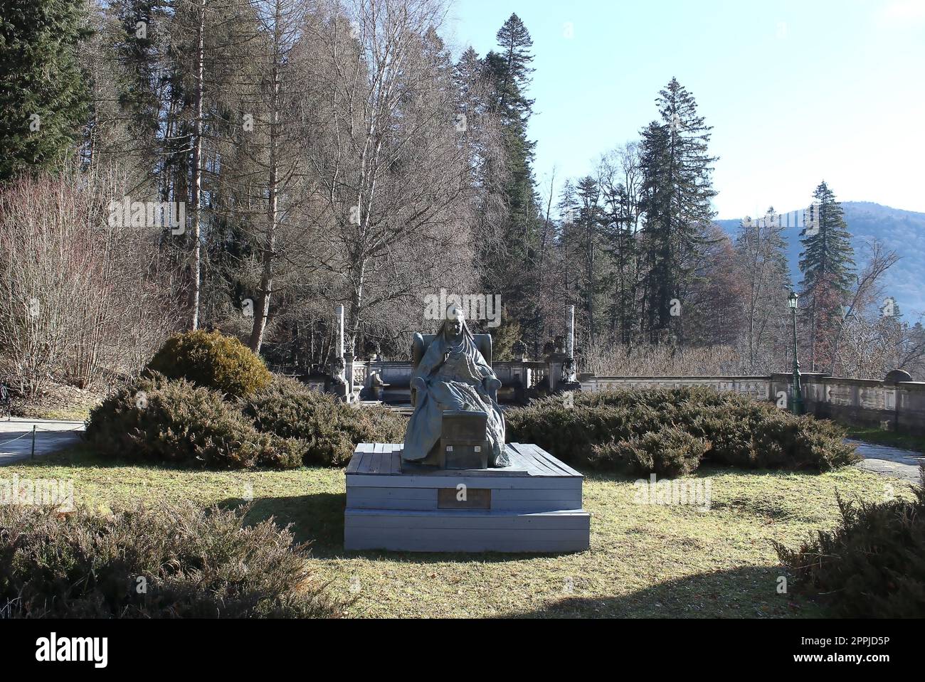 Sinaia, Romania - December 31, 2022: Bronze statue of seated Queen ...