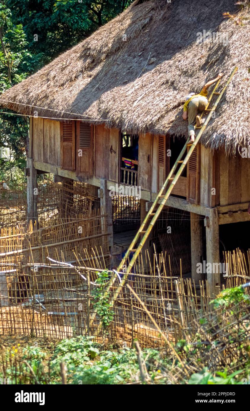 Scanned slide of a historical color photograph of pile dwellings in a ...