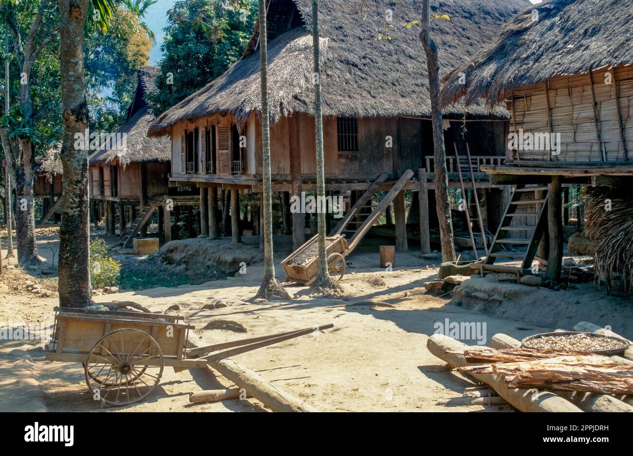 Scanned slide of a historical color photograph of pile dwellings in a ...