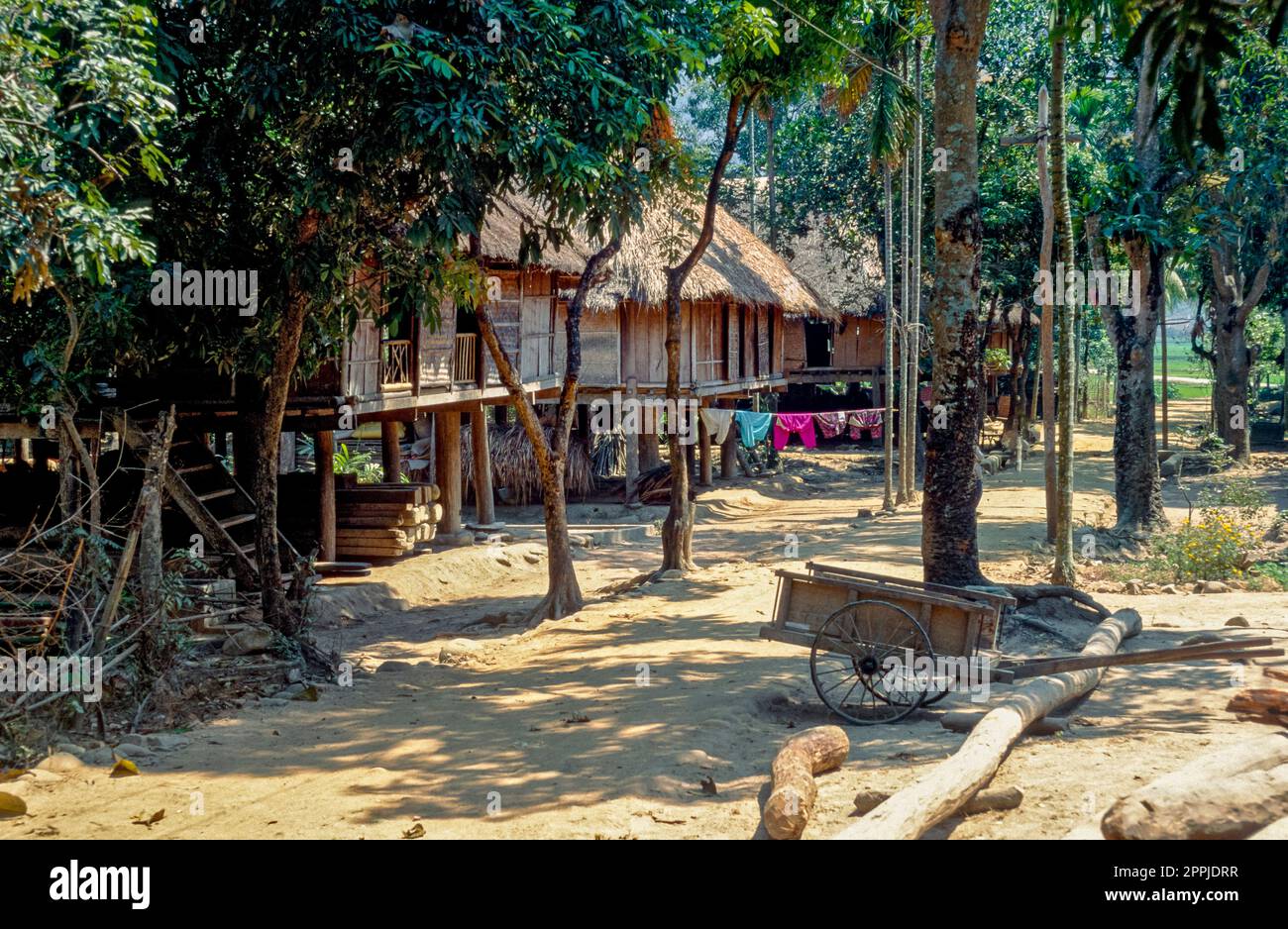 Scanned slide of a historical color photograph of pile dwellings in a ...
