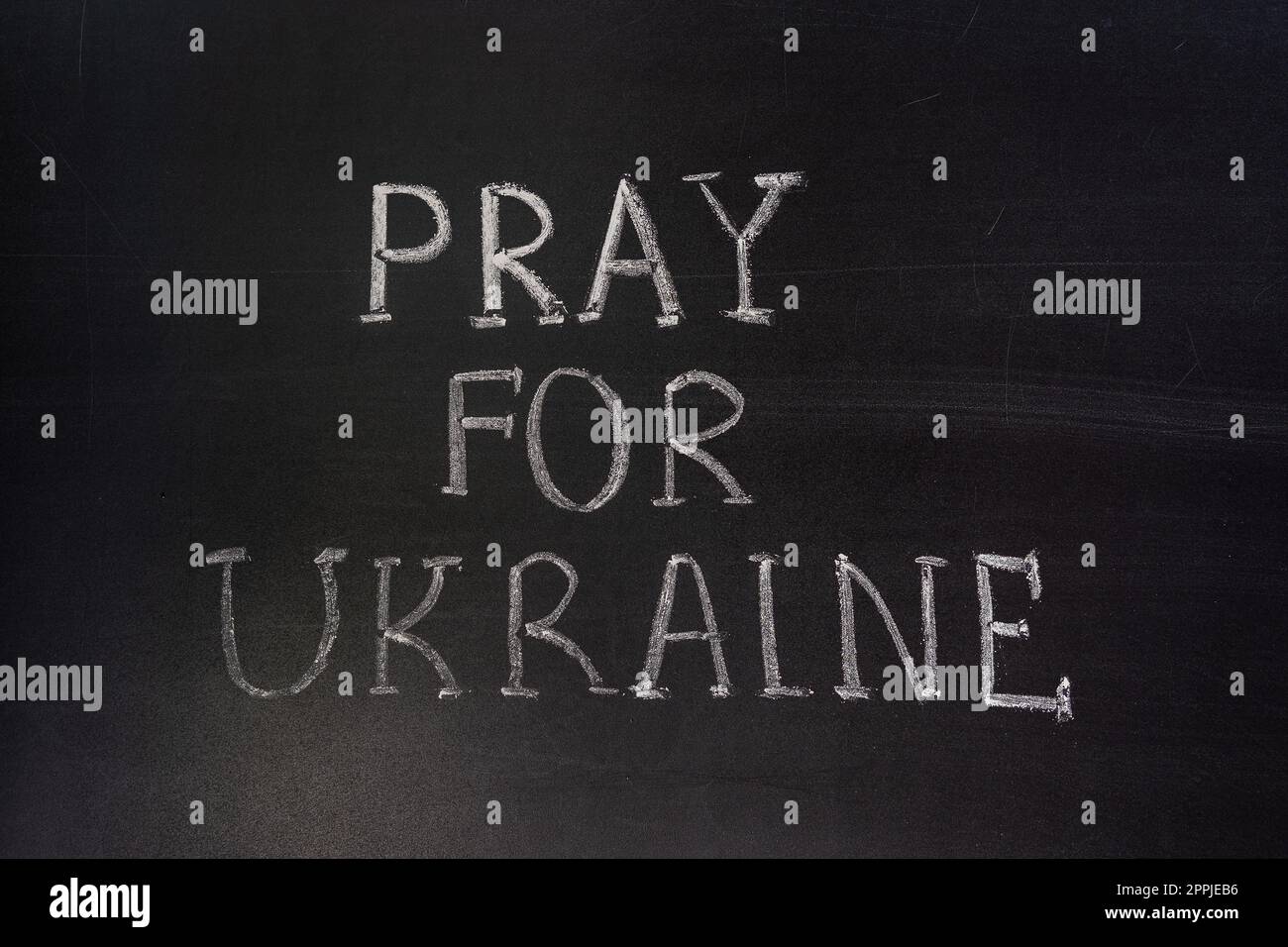 Words "Pray for Ukraine" writed on blackboard Stock Photo - Alamy