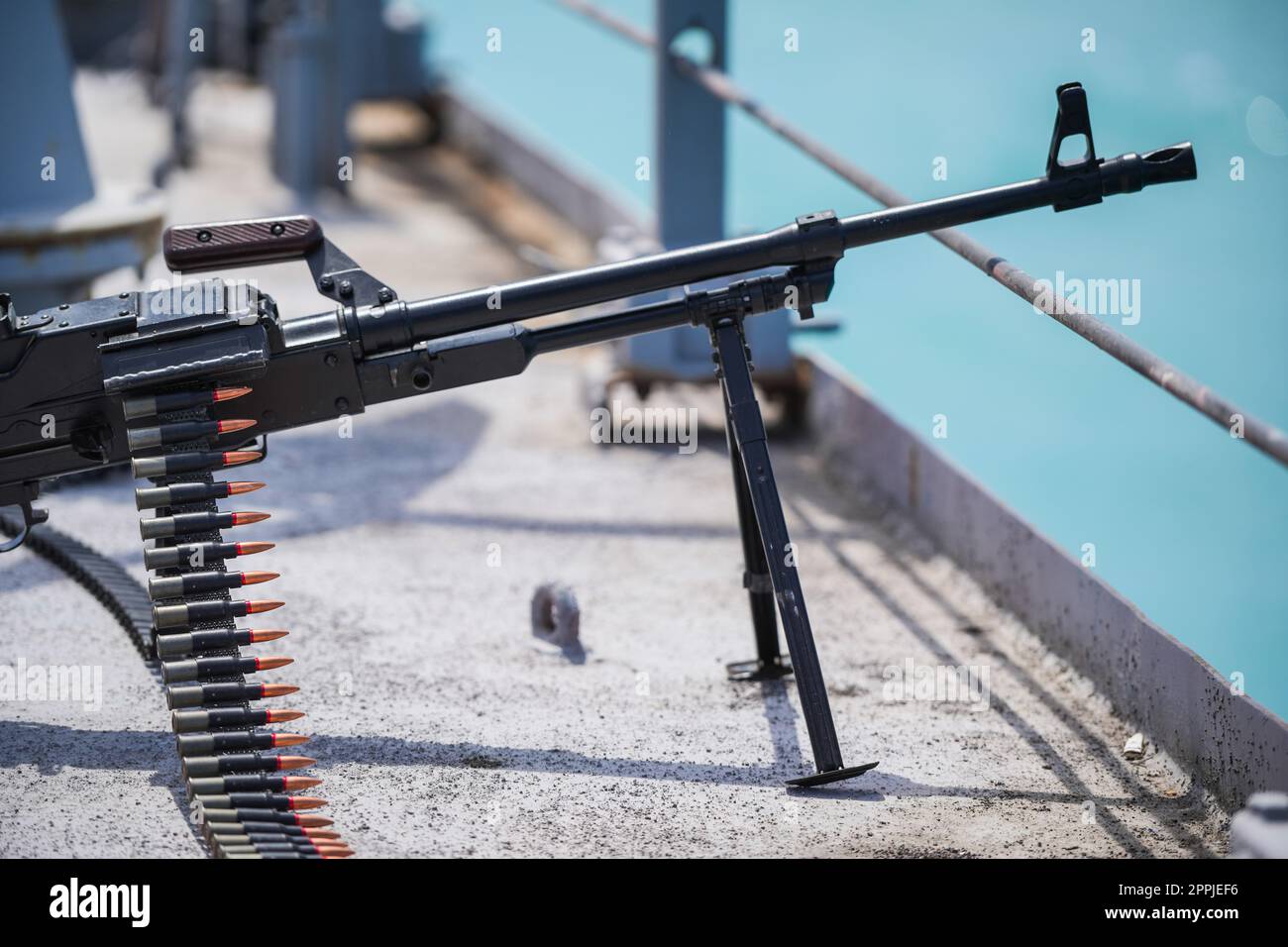 Machine gun belt loaded with cartridges Stock Photo - Alamy