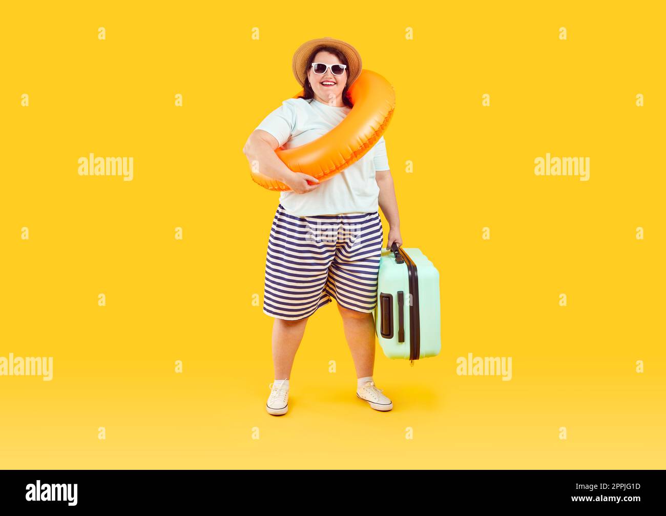 Funny fat woman in sunglasses in rubber ring jumping and having fun on ...