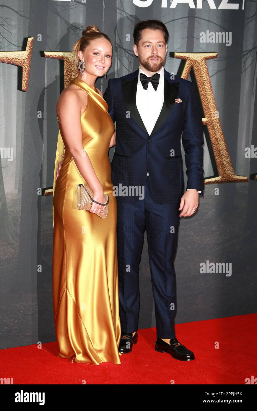 London, UK. 24th Feb, 2022. Richard Rankin and guest attend the ...