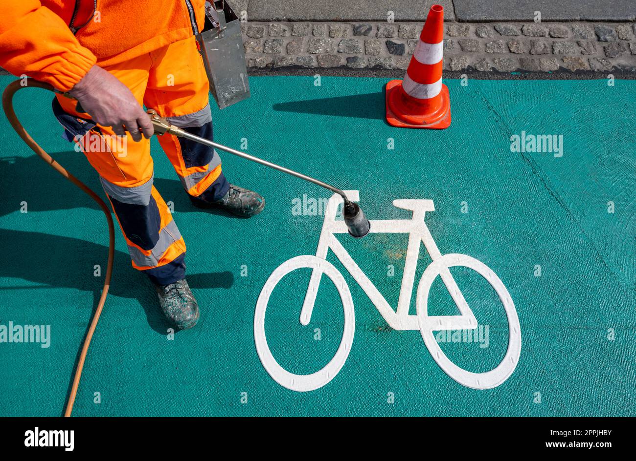 Leipzig, Germany. 24th Apr, 2023. Marking work for a new bike path is ...