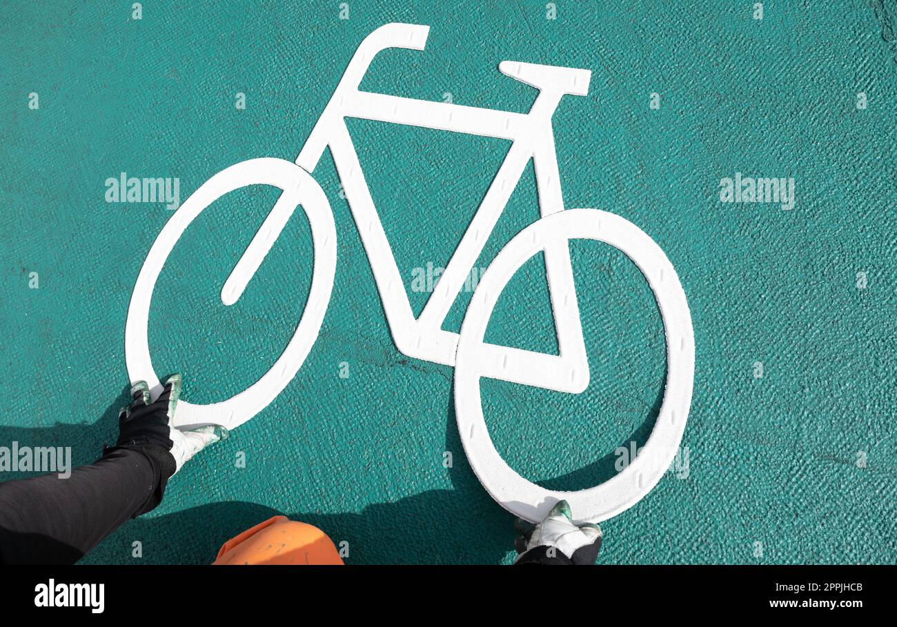 Leipzig, Germany. 24th Apr, 2023. Marking work for a new bike path is ...