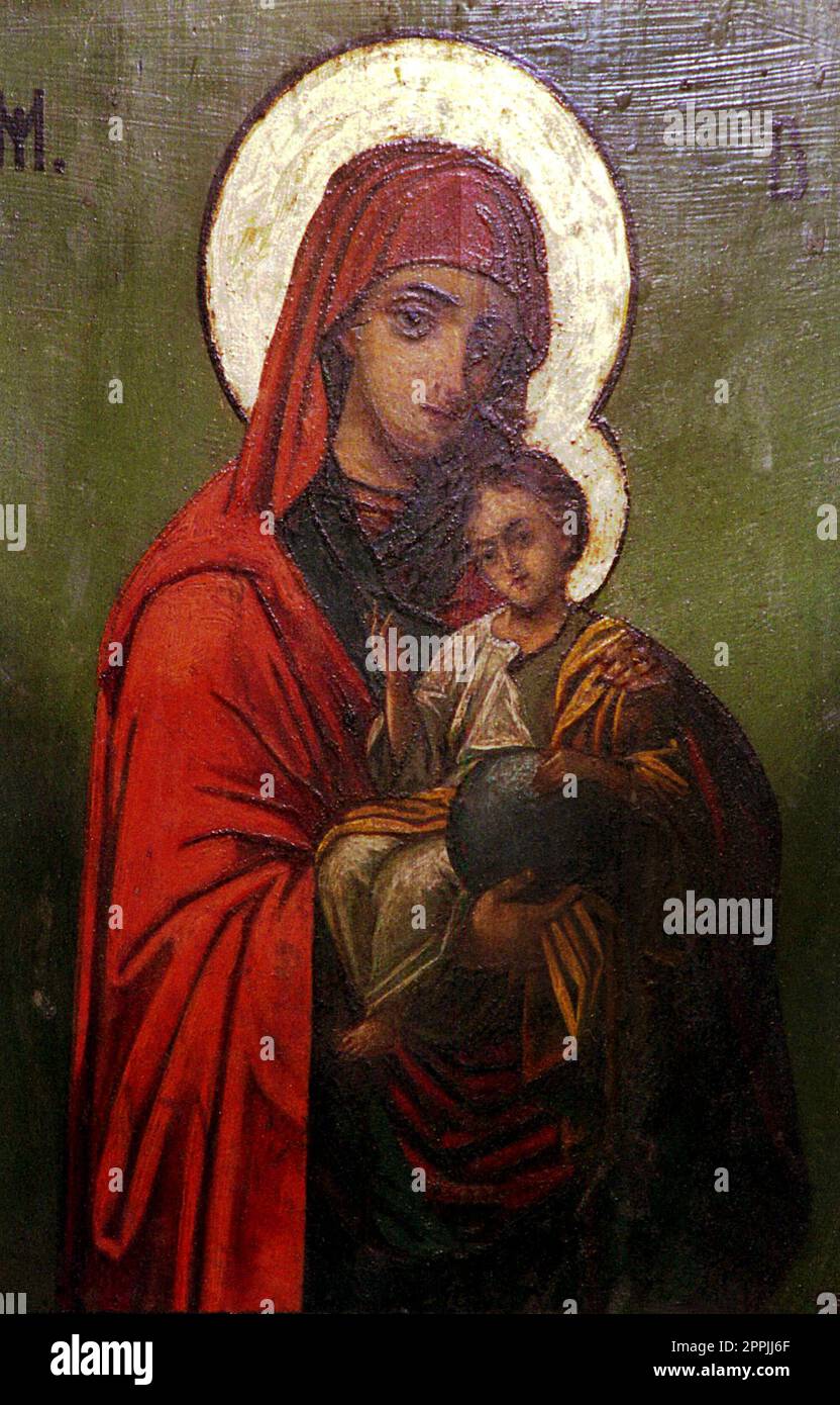 Old Eastern Orthodox hand-painted icon depicting Virgin Mary holding ...