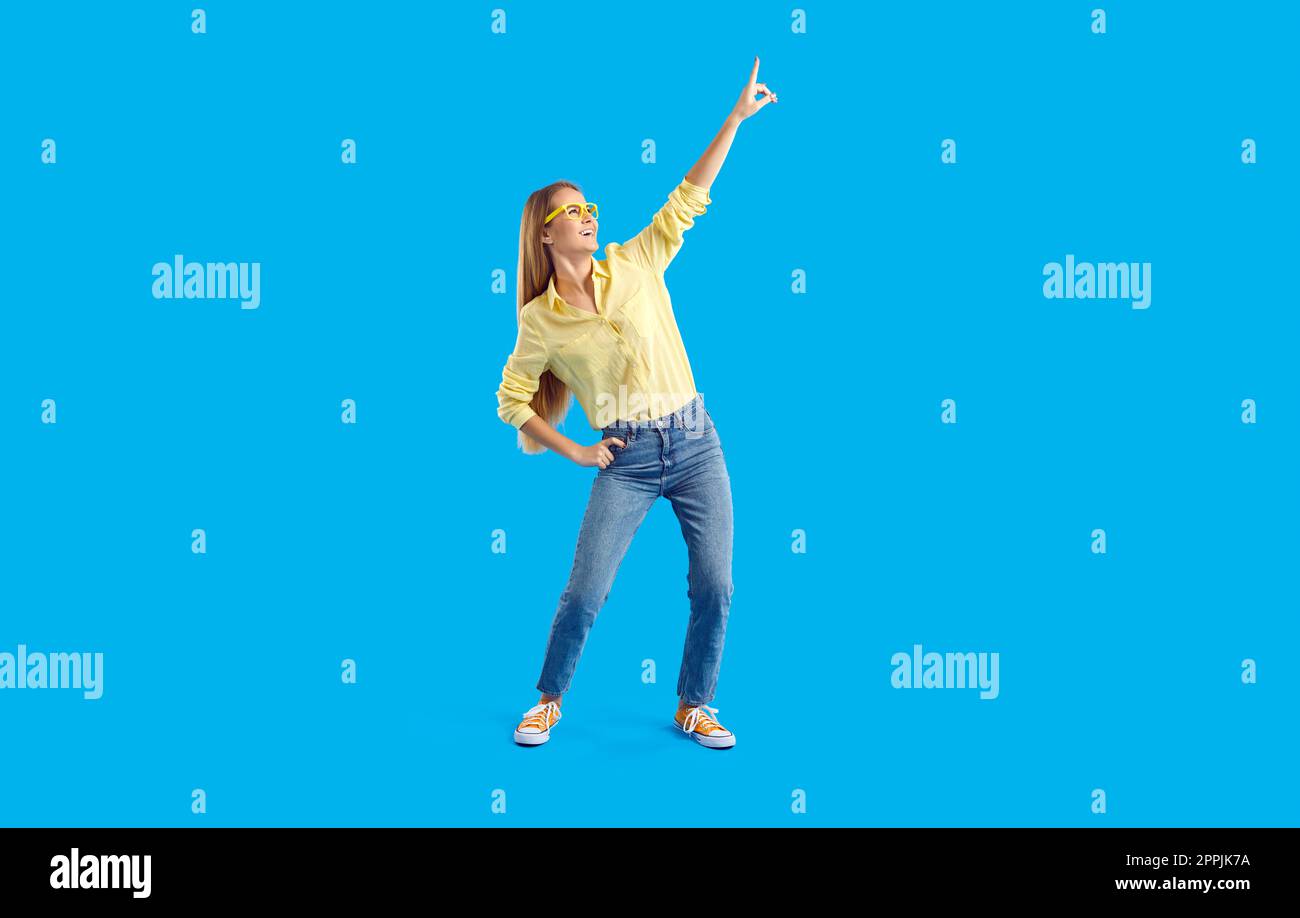Smiling girl have fun dancing on studio background Stock Photo - Alamy