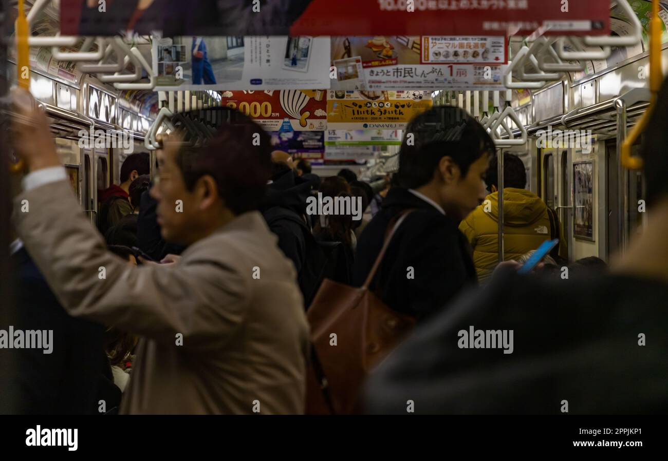 A picture of local commuters riding the subway in Kyoto Stock Photo - Alamy