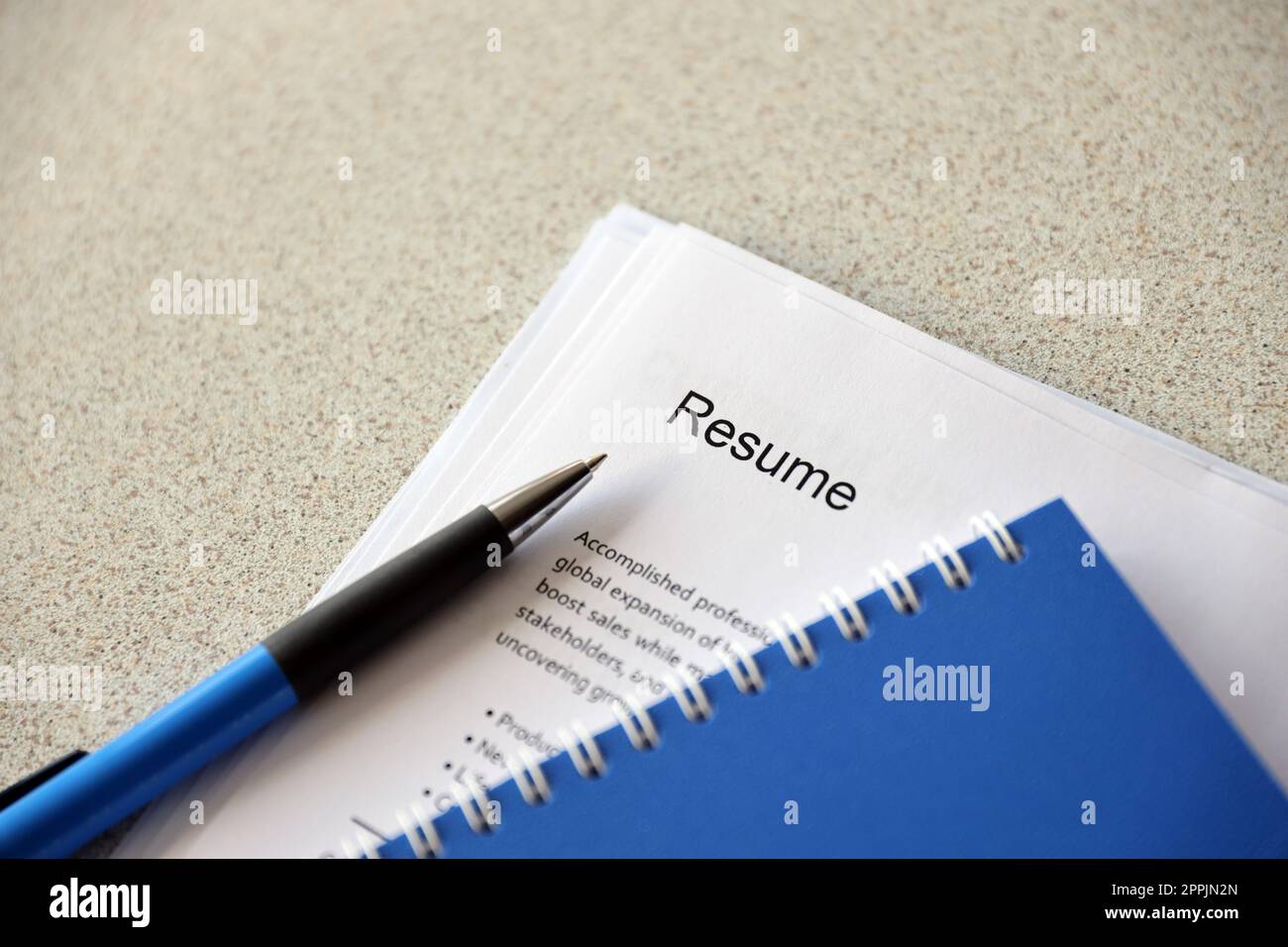 Top view of stack of office documents including resume and cv forms on ...