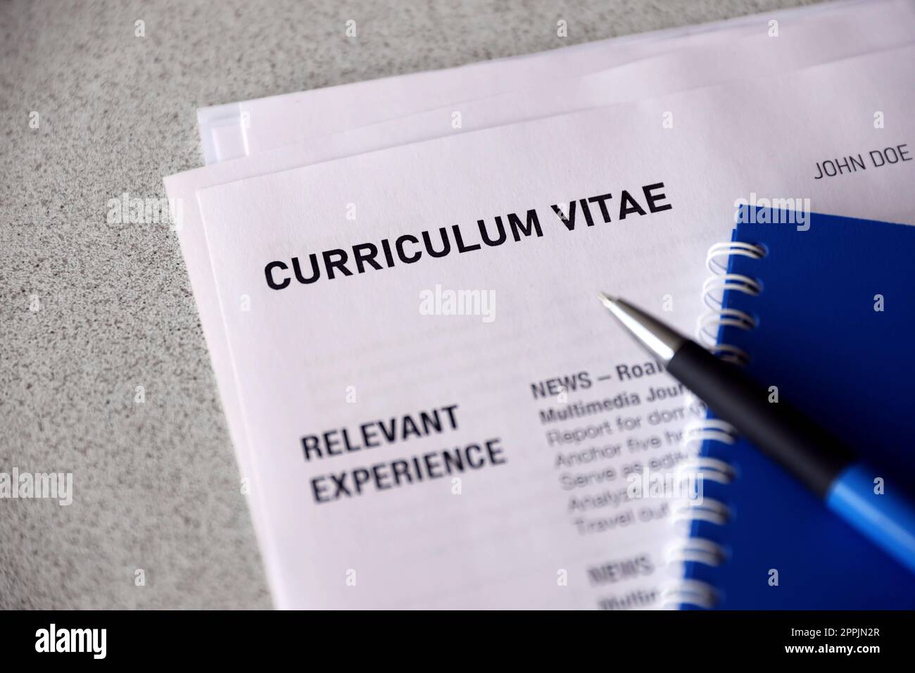 Top view of stack of office documents including resume and cv forms on ...