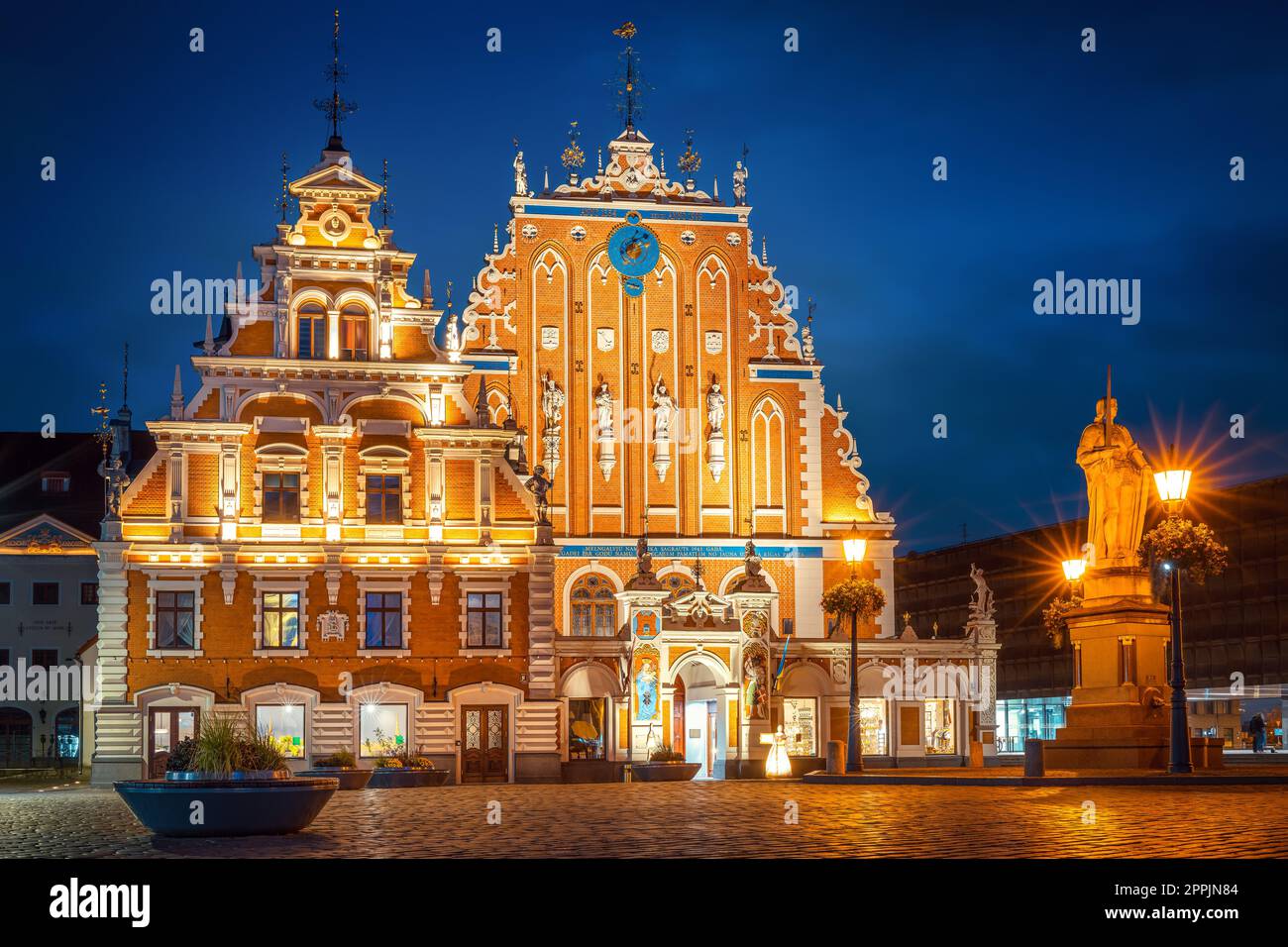 the famous houses of the blackheads in riga at night Stock Photo - Alamy