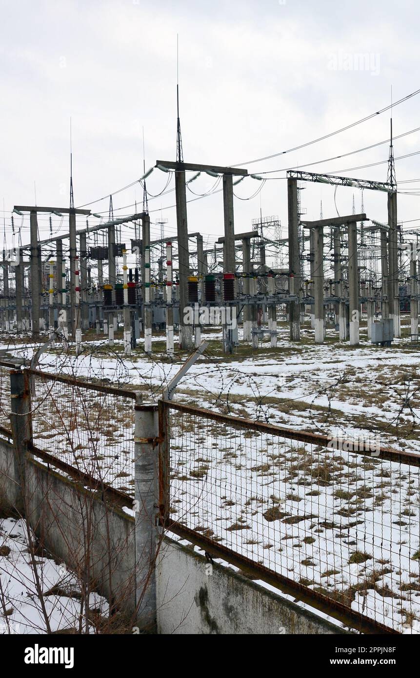 Power plant is a station of transformation. A lot of cables, poles and ...